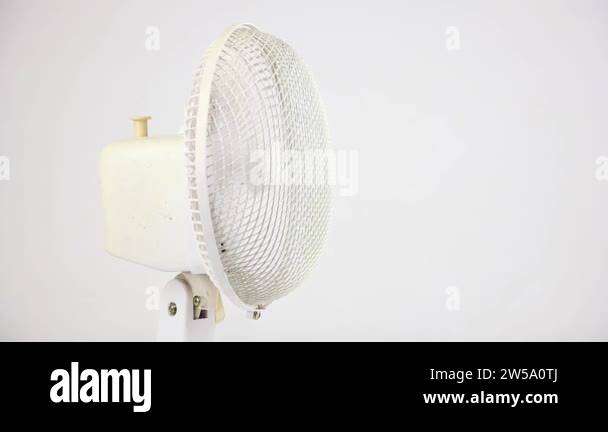 rotating white fan ventilator on left side on white background ...