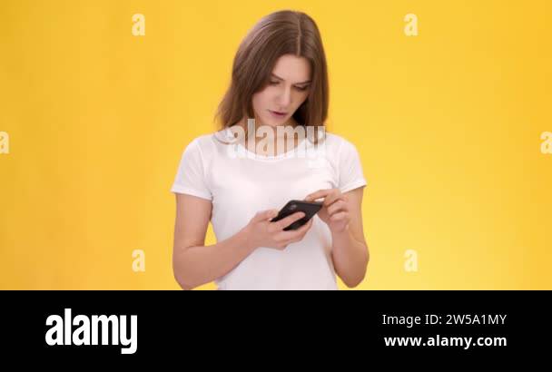 Young woman browsing social media, looking at awful news and shaking ...