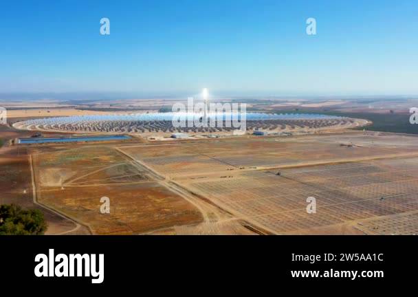 Aerial view of a large solar thermal plant uses mirrors that focus the ...