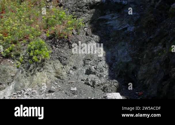 vertical overview of a granite cliff Stock Video Footage - Alamy