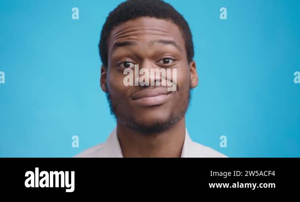 Close up portrait of silly black man with unsure facial expression ...