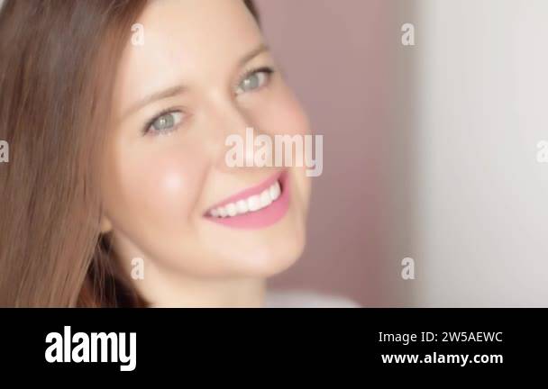 Beautiful woman with glowing healthy skin, natural makeup and long ...