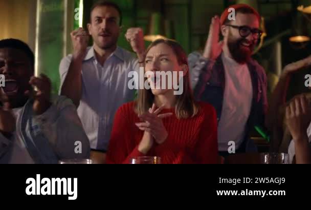 Group of joyful friends clapping and giving high five after singing ...