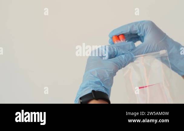girl holds a kit for a dna test in a box, a cotton swab for scraping ...