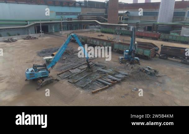 Recycling of metal. Excavator with grab, Recycling metal waste, metal ...