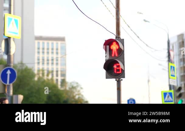 Traffic light in the city. Changes from green to red, urban scene. A ...