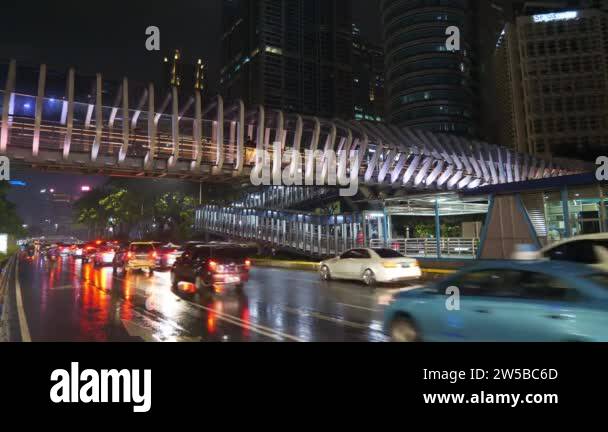 Night illumination in Jakarta city. Pedestrian bridge. Indonesia ...