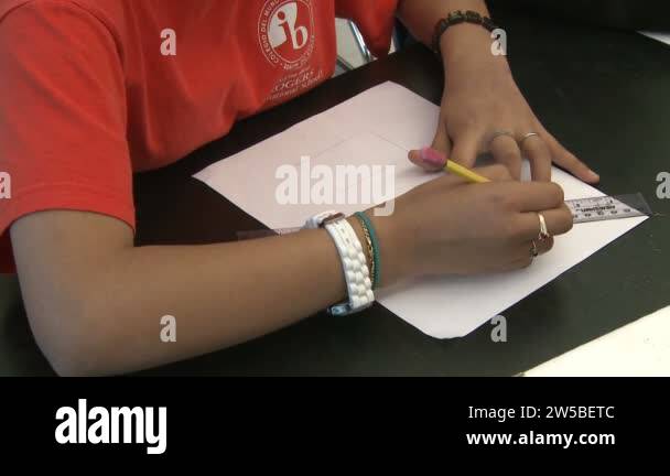 Grammar school student drawing an angle on her paper Stock Video ...