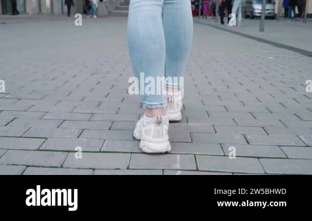 Rear view feet of woman legs close-up crossing the road. 4k Stock Video ...