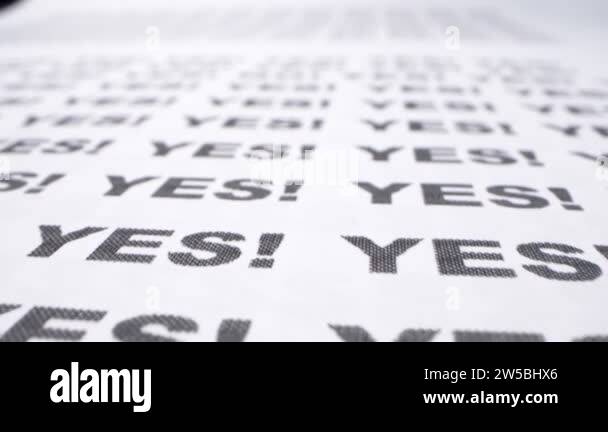 text background. close-up. typing the word yes with an exclamation mark ...