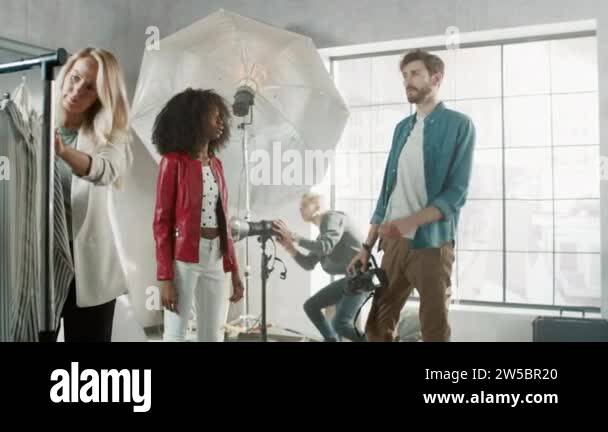 Backstage of the Photo Shoot: Stylist Chooses Outfit and Clothes for a ...