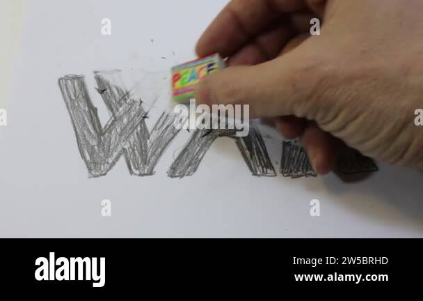 eraser with written PEACE deletes the written WAR Stock Video Footage ...