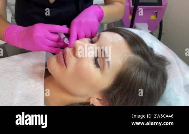 Cosmetologist doctor is making multiple injections biorevitalization ...