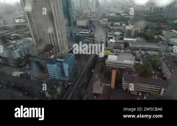 Rain drop on window. Aerial view. Raining outside living room window on ...