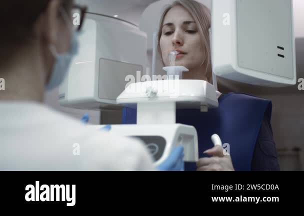 Dental jaw scanning. Patient girl inside a panaromaniac 3d scanner of ...