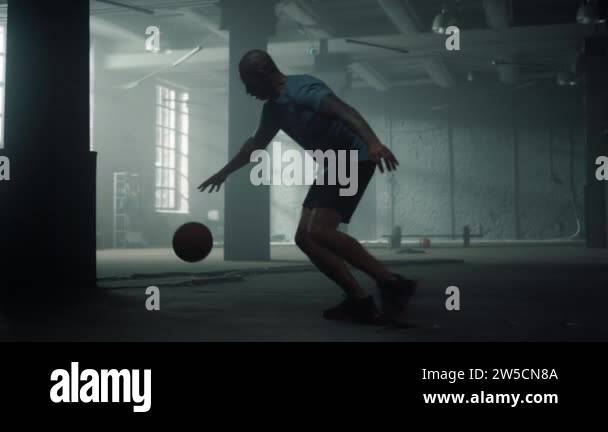 Basketball player bouncing ball in sport club. Sportsman dribbling ball ...
