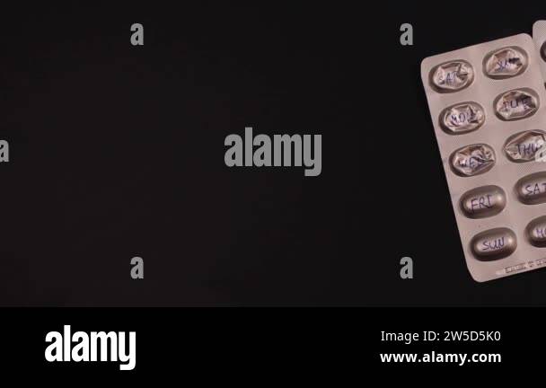 Pills in blister with hand written days of the week on each cell ...