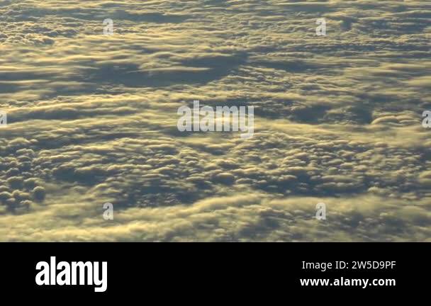 Flying above the clouds. Actual airplane high altitude footage. Cockpit ...