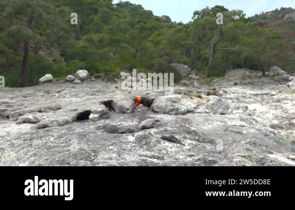 Flame of Methane Underground Emerges From Crack Between Rocks and Burns ...