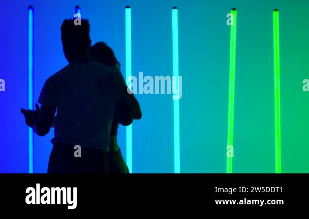 Hot dance of two professional dancers, slow motion. Silhouettes of ...