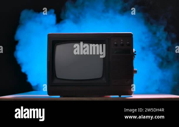 Style retro Tv set with switchers. Old fashioned TV against a smoky ...