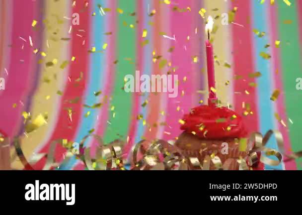 Animation of gold confetti falling over lit candle on birthday cupcake ...
