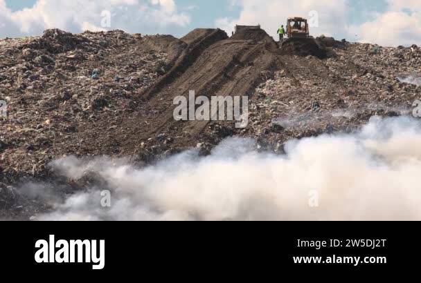 Air pollution caused by fire on dump site. Clouds of smoke above the ...