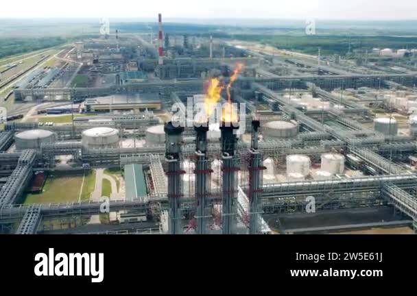 Pipes of the oil refinery are flaring gas Stock Video Footage - Alamy