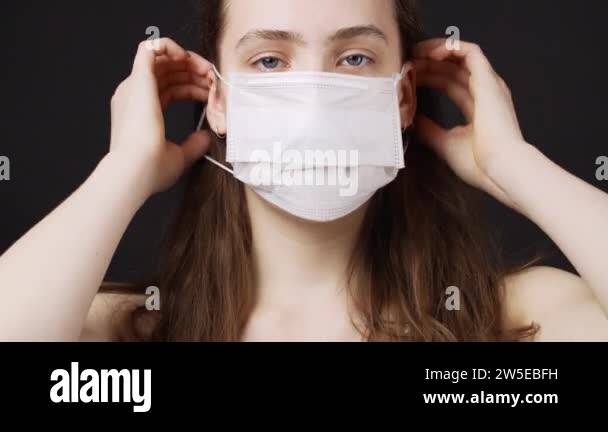 Video woman dressing medical mask Stock Videos & Footage - HD and 4K ...