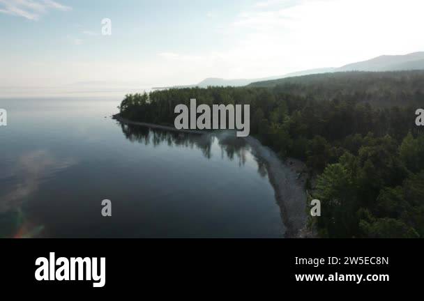 Fantastic panorama of Lake Baikal at sunset is a rift lake located in ...