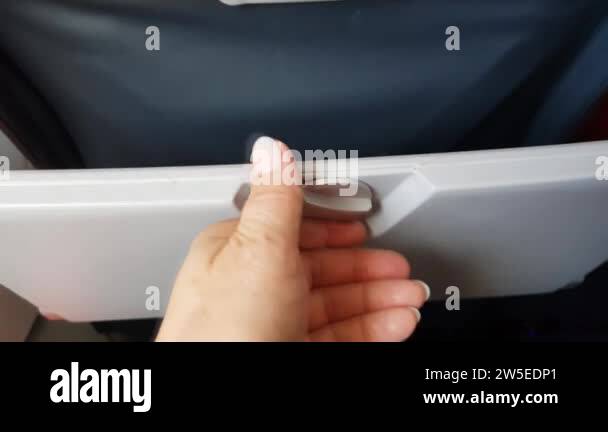 Airplane seat tray Stock Videos & Footage - HD and 4K Video Clips - Alamy
