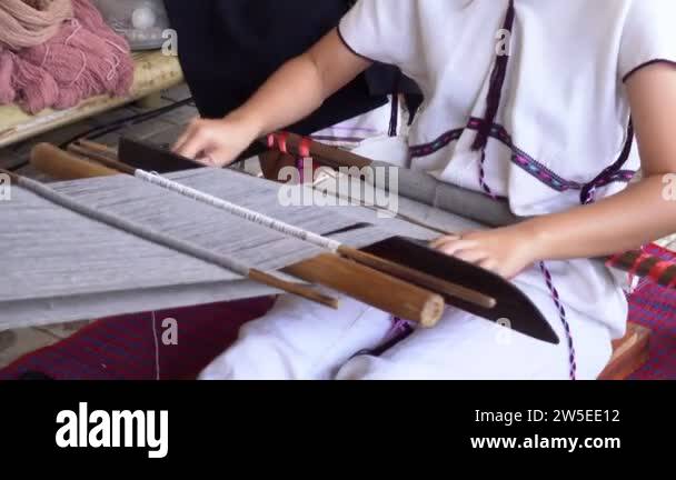 Young Woman Karen Tribal Weaving of traditional in thailand. Close up ...