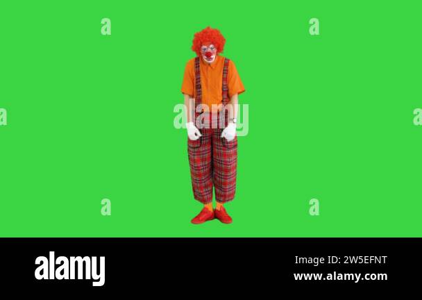 Unhappy clown standing and being nervous on a Green Screen, Chroma Key ...