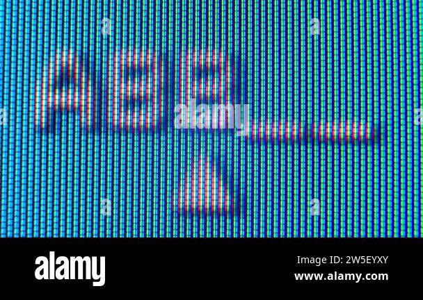 Pixels in the working old analog TV screen close up. Red, blue and ...