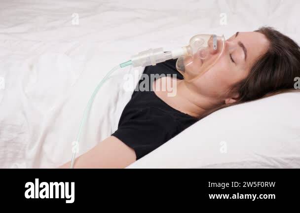 woman sleeps with oxygen mask falling off the face Stock Video Footage ...