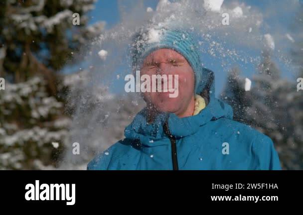 PORTRAIT, DOF: Squinting male tourist gets hit in the face by a fluffy ...