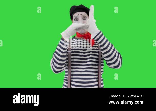 Mime performing like he is drowning on a Green Screen, Chroma Key Stock ...