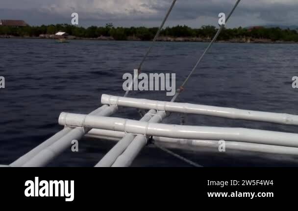Bamboo wings of philippine boat on background of sea on Philippines ...