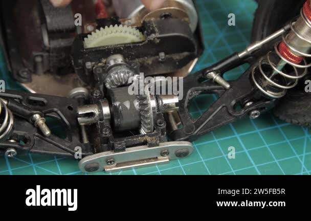 Close-up radio control model buggy car. The hands of the master ...