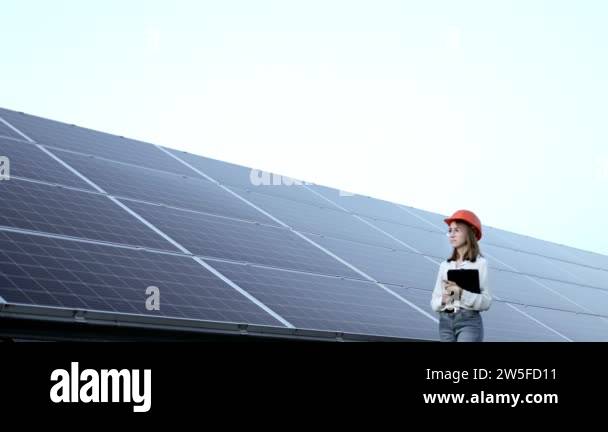 Handsome Architect Woman Examining a Draft Map or Blueprint Project ...