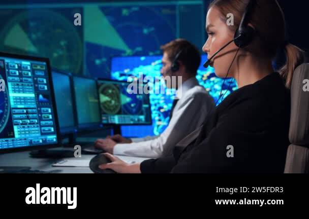 Workplace of the air traffic controllers in the control tower. Team of ...