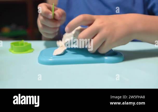 Child is sculpting with modeling clay. Art activity for children ...