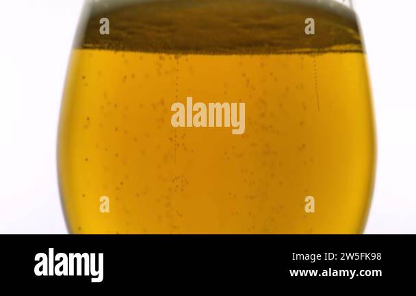 Lager beer bubbles filmed in slow motion video clip. Enjoy fresh golden ...