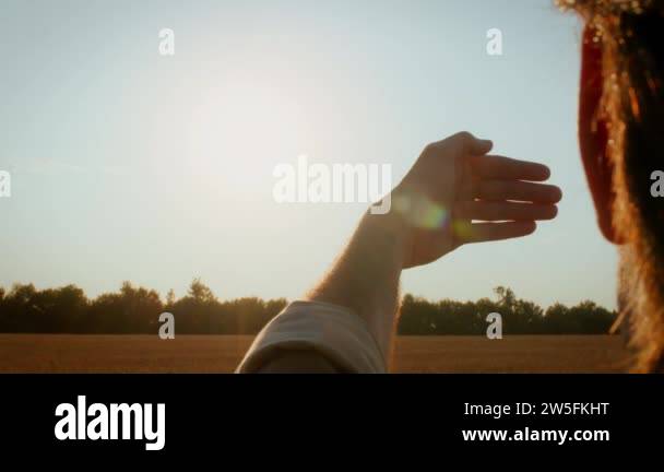Man hand touch sun Stock Videos & Footage - HD and 4K Video Clips - Alamy