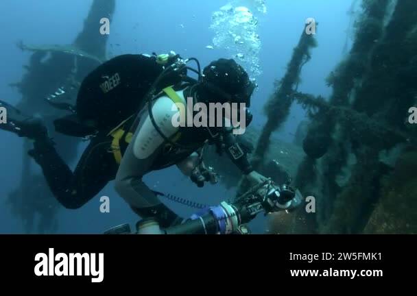 MEDITERRANEAN SEA, CYPRUS - AUGUST, 2021: Scuba diver photographer ...