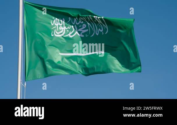 Flag of Saudi Arabia Lit by the Sun. The Big State Flag is illuminated ...