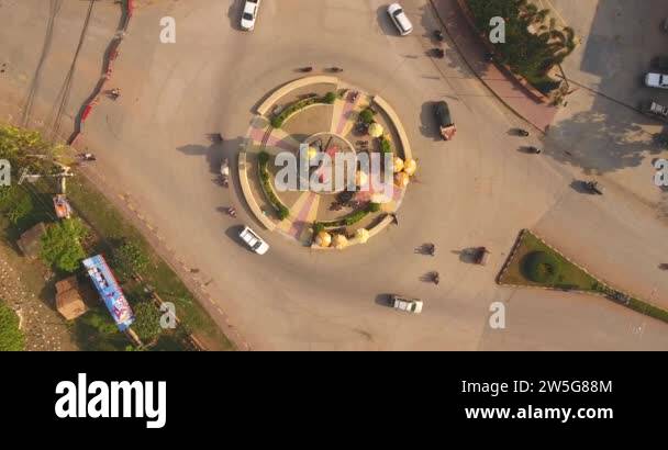 fly downward the giant buddha statue at traffic roundabout Stock Video ...