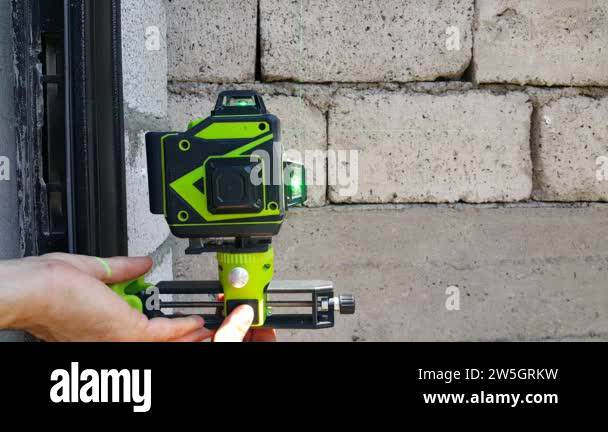 Laser level gauge for measuring green light on a construction site for ...