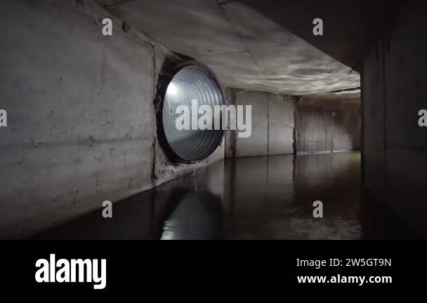 Concrete sewer or drainage collector filled with water, in which a ...