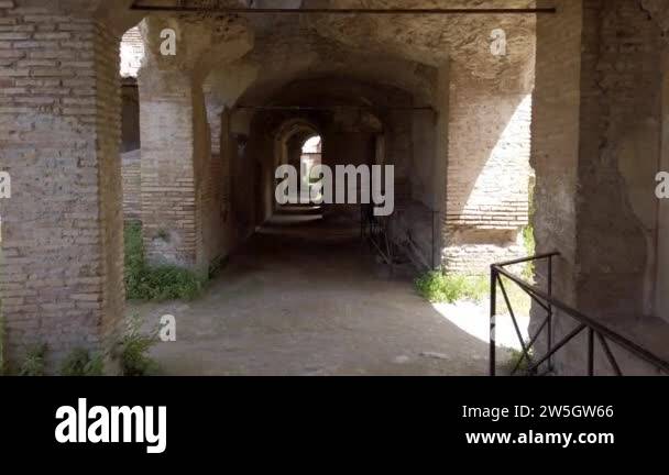 Suggestive Fpv explore the past in ancient ruined corridor with bricks ...